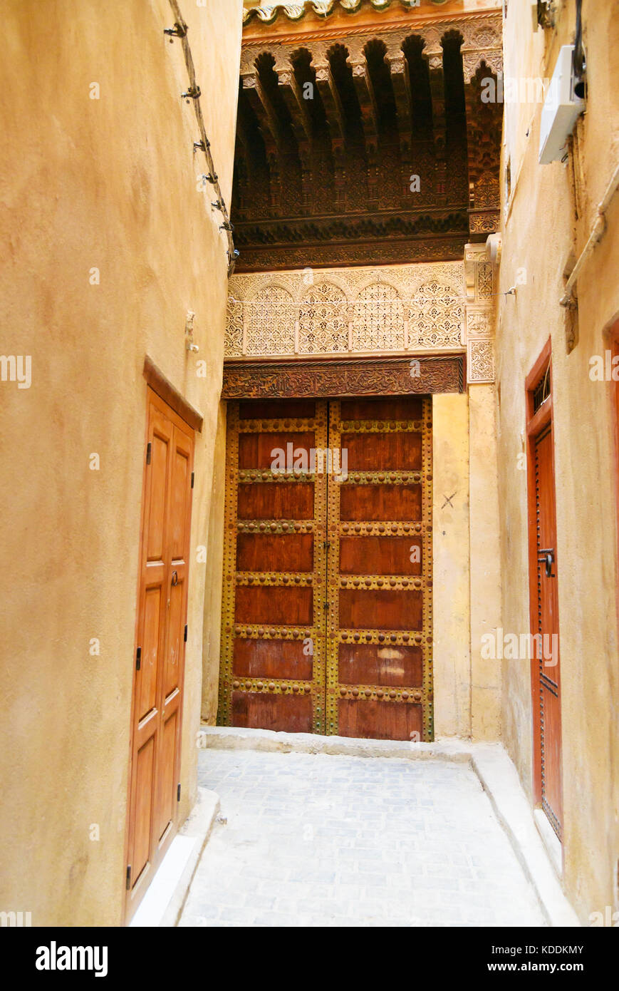 On the narrow ancient street in Fes El Bali old medina. On the narrow ...