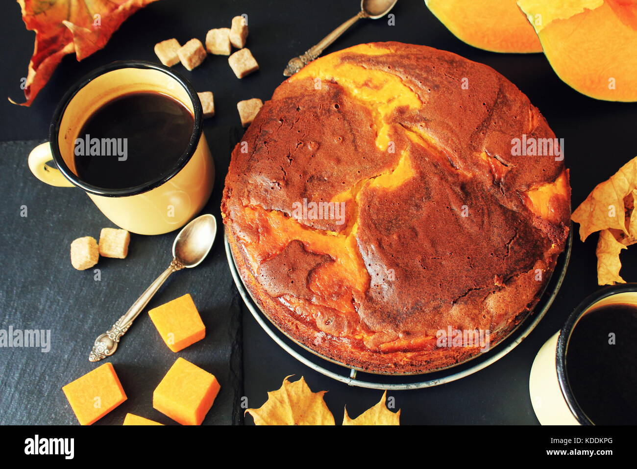 Pumpkin chocolate cake on dark background with fall leaves, top view ...