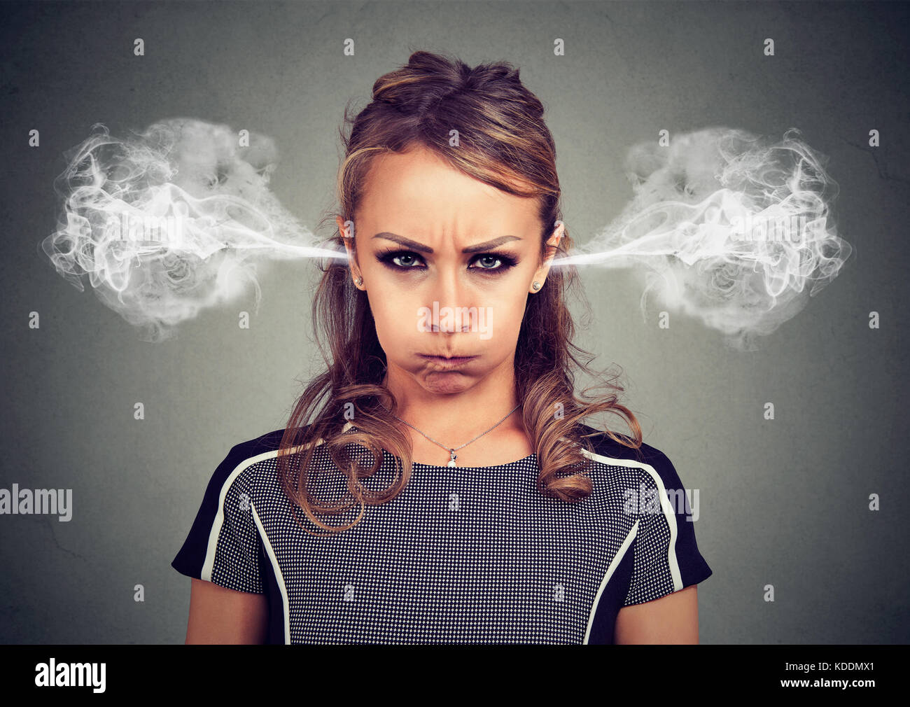 Closeup portrait of angry young woman, blowing steam coming out of ears ...