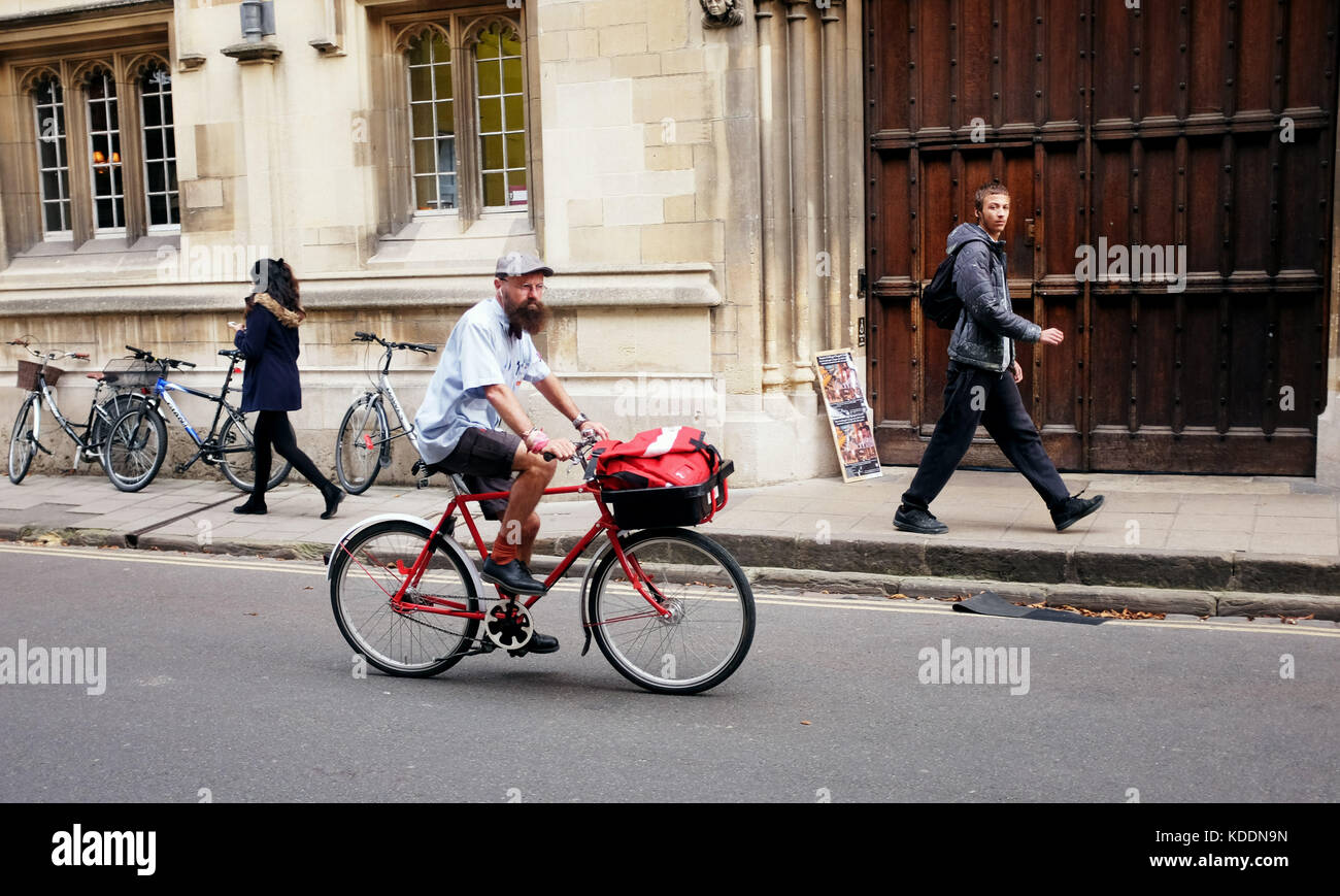 Postman on his bicycle hi-res stock photography and images - Alamy