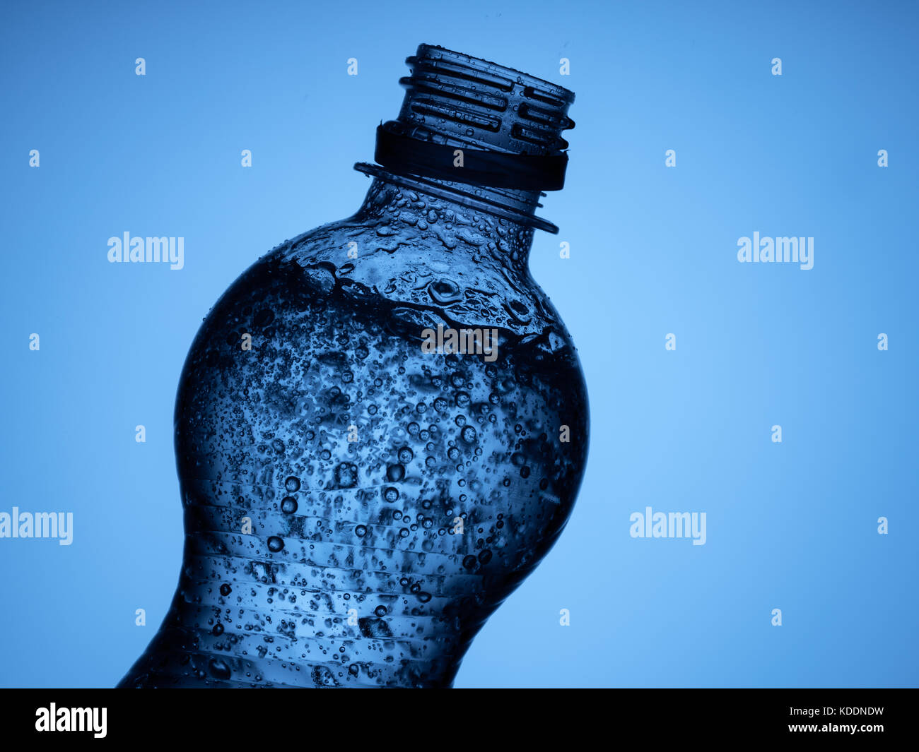 open plastic bottle of soda water isolated on a blue background Stock ...