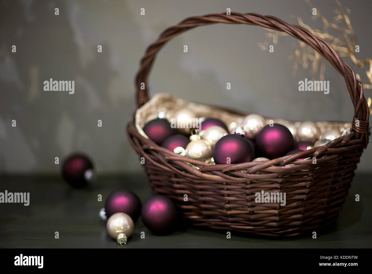 shiny and matt Christmas tree toys silver and vinous colors in a wicker ...
