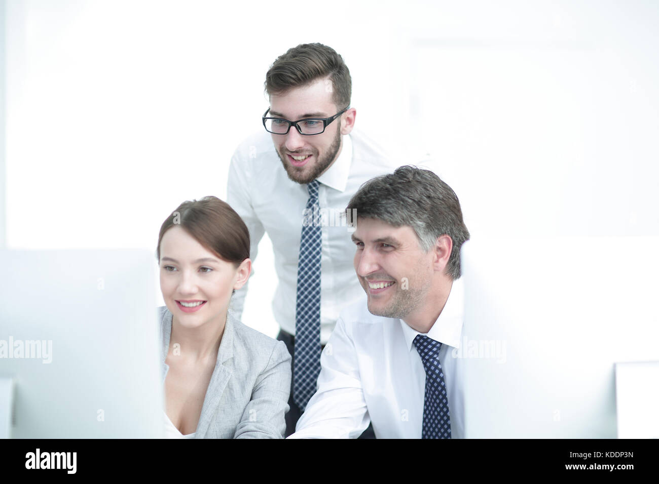 Portrait of three colleagues in the workplace Stock Photo - Alamy