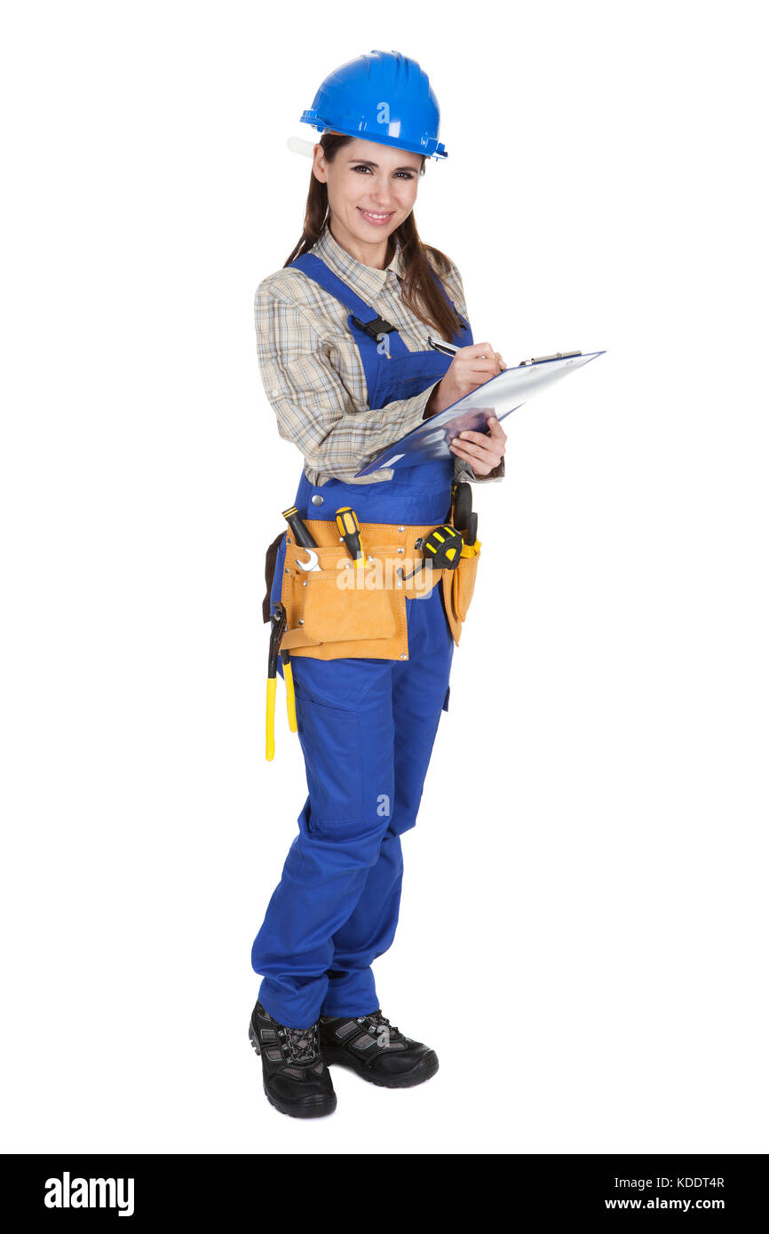 Portrait Of Young Female Worker Writing On Clipboard Stock Photo - Alamy