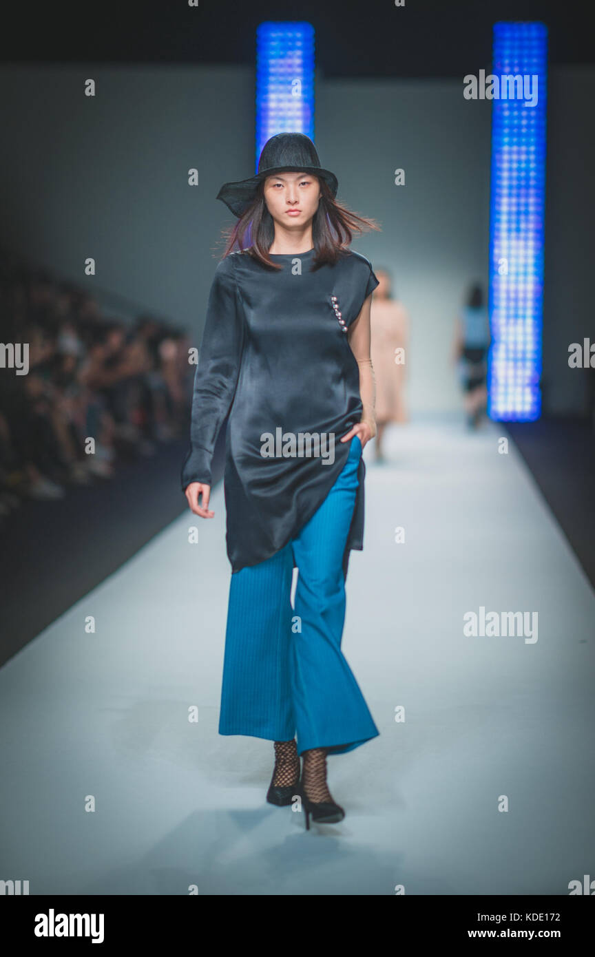 Shanghai, China. 13th October, 2017. A model presents a creation at the ...