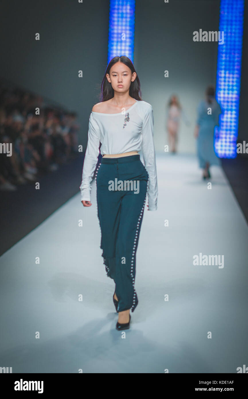 Shanghai, China. 13th October, 2017. A model presents a creation at the ...