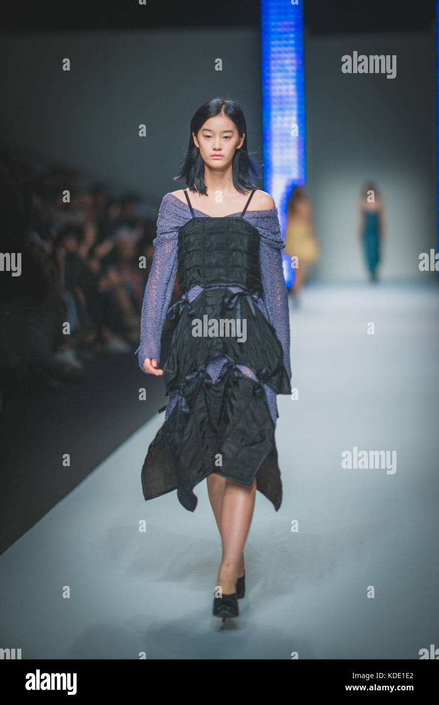 Shanghai, China. 13th October, 2017. A model presents a creation at the ...