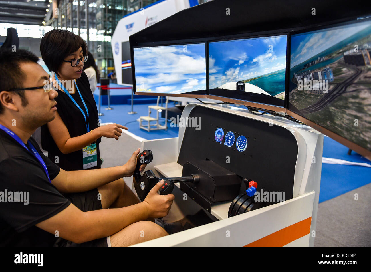 Shenzhen. 13th Oct, 2017. A visitor tries flight simulator at the 5th ...