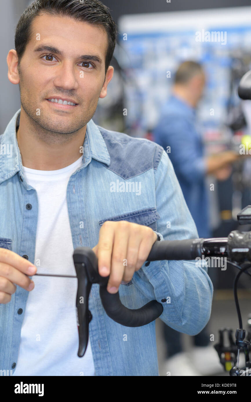 portrait of salesman in bicycle shop Stock Photo - Alamy