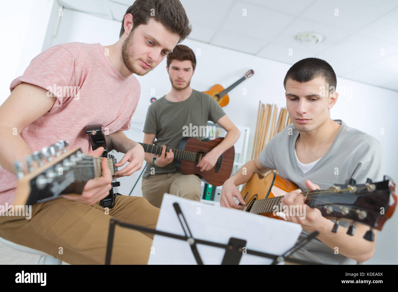 home band learning new song together Stock Photo - Alamy