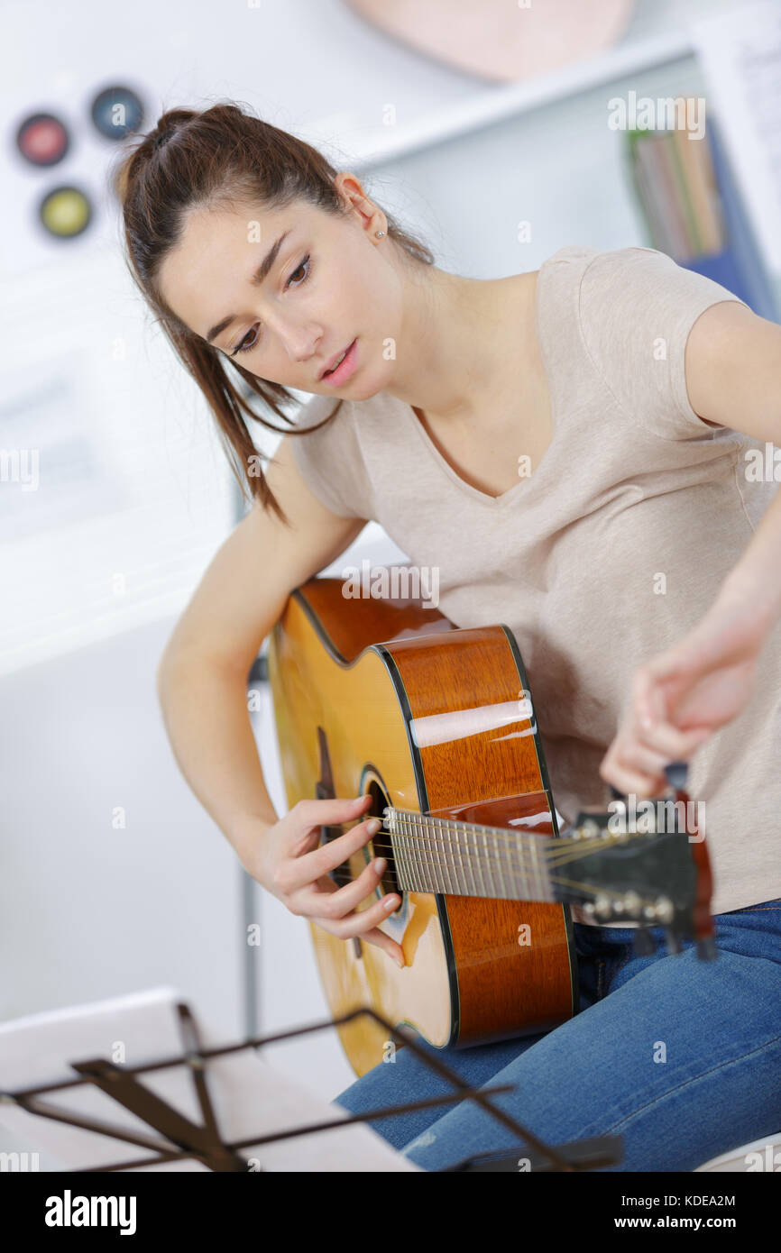 female teen playing guitar at home Stock Photo - Alamy