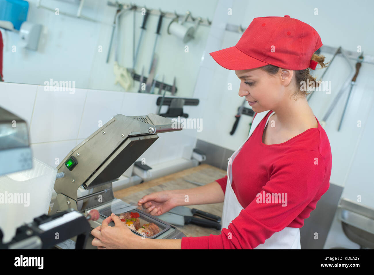 Supermarket deli worker hi-res stock photography and images - Alamy