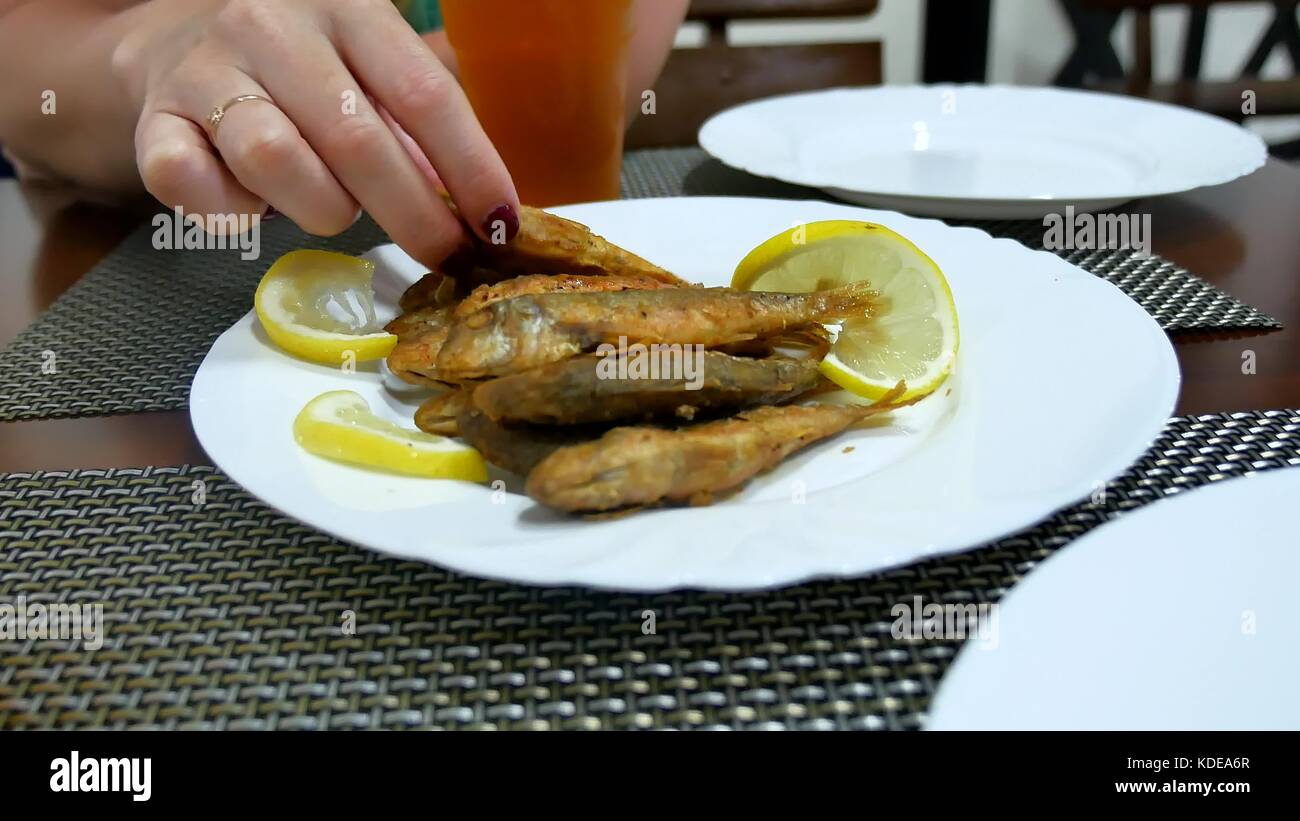 Fried surmullet fish on a plate with lemon. Delicious dinner Stock ...