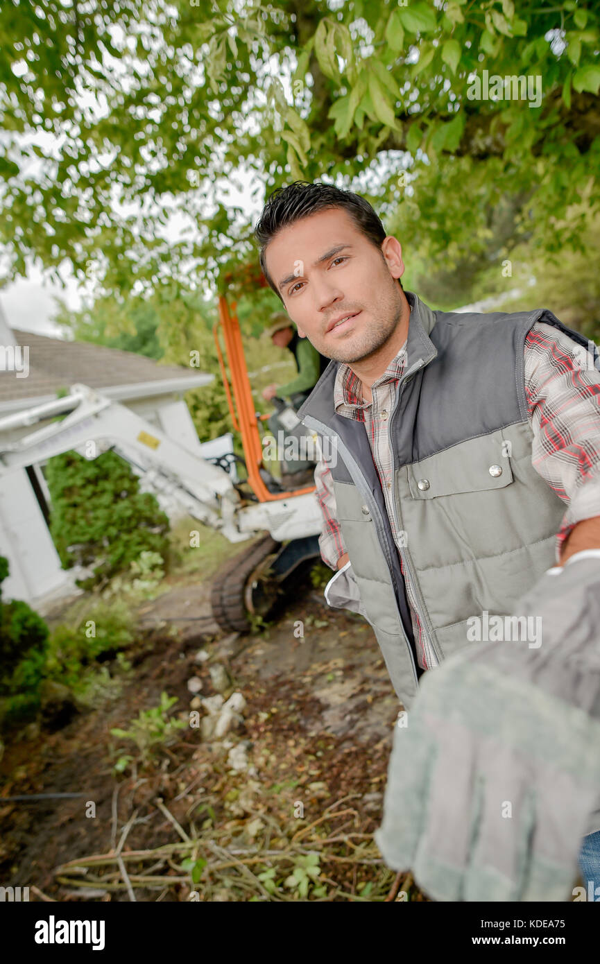 Gardener working in backyard Stock Photo - Alamy