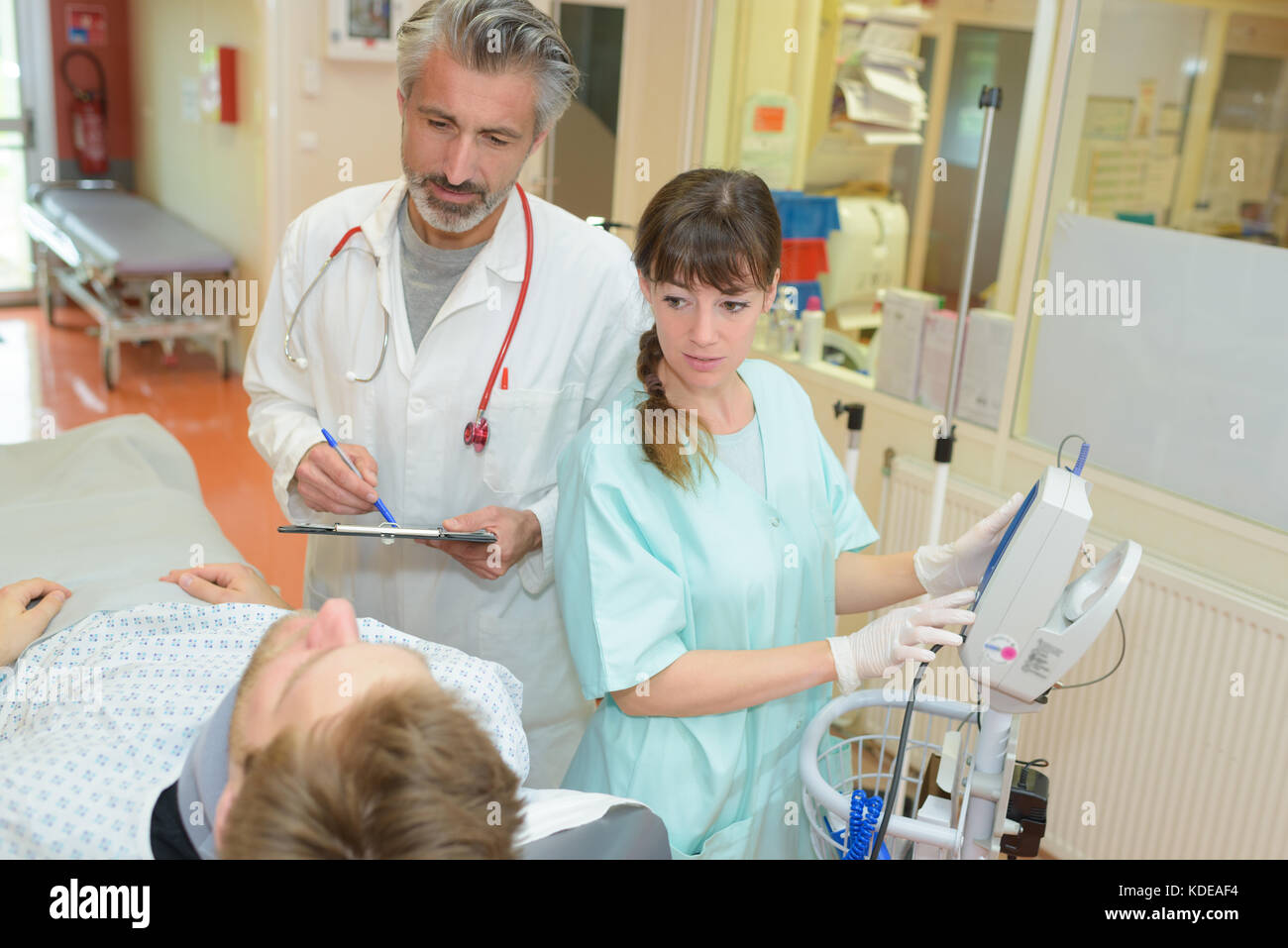 doctor and nurse telling patient the diagnosis Stock Photo - Alamy