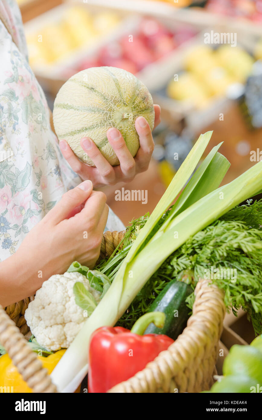 holding a melon Stock Photo - Alamy