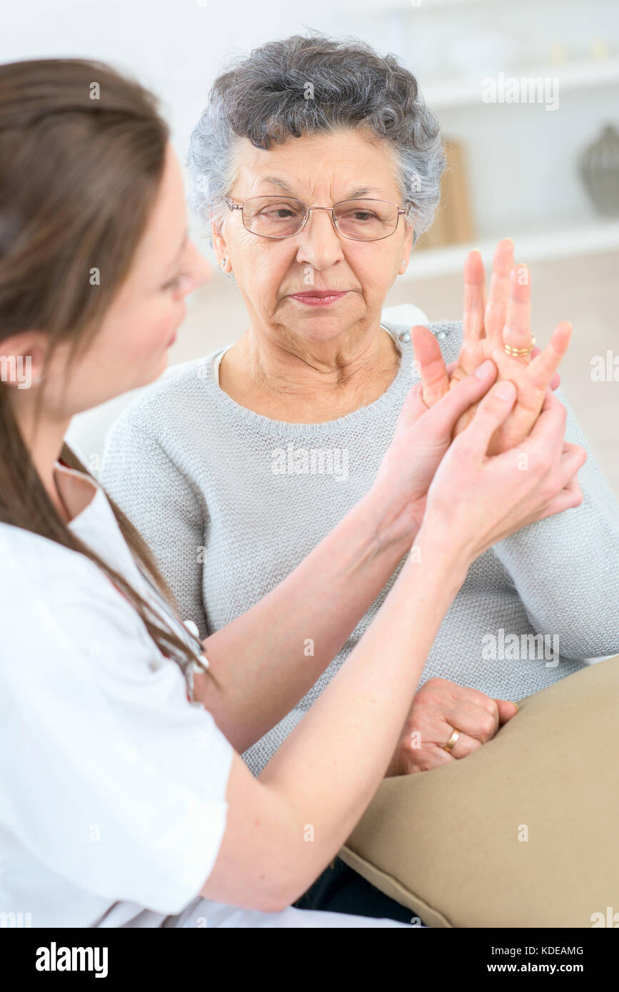 Doctor checking elderly patients hi-res stock photography and images ...