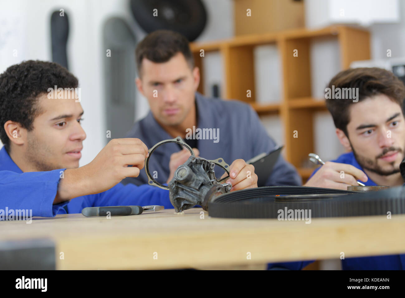 Apprentice mechanics being assessed while working Stock Photo - Alamy