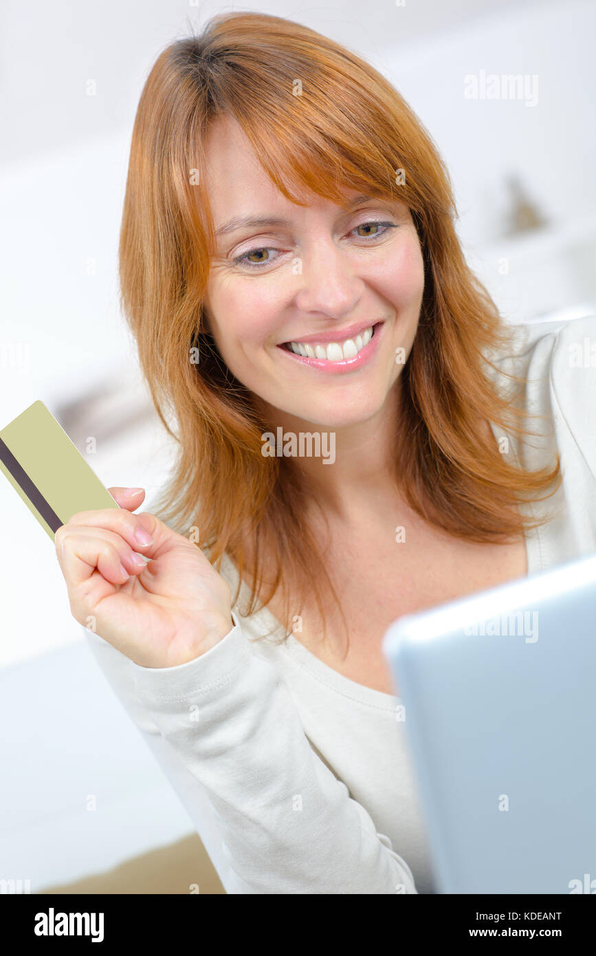 attractive woman holding debit card for online shopping Stock Photo - Alamy