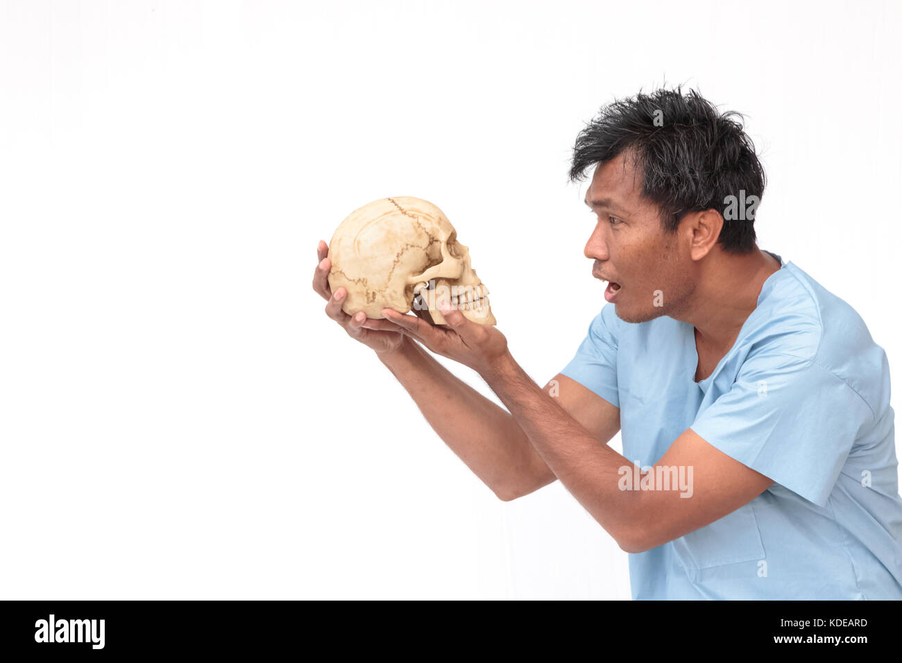 Man holding skull hi-res stock photography and images - Alamy