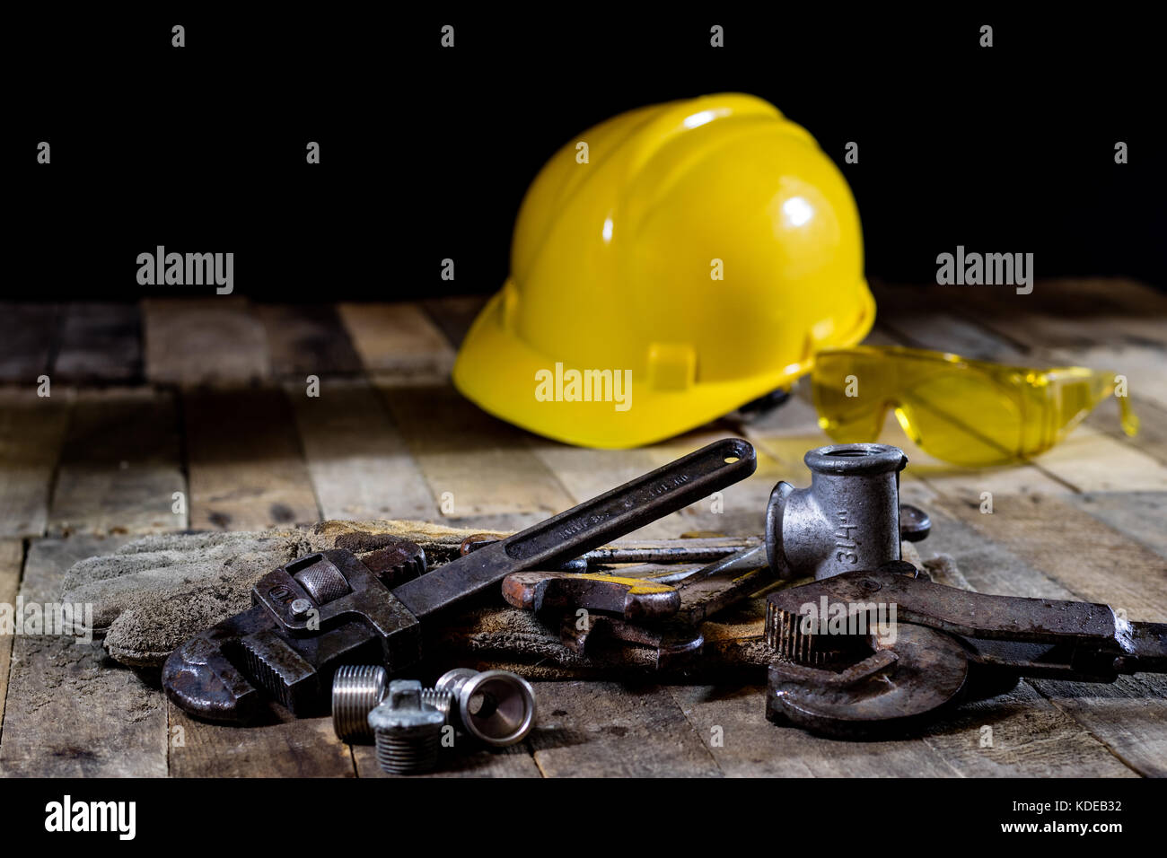 Hydraulics, tools for plumber on wooden table. Workshop, table and ...