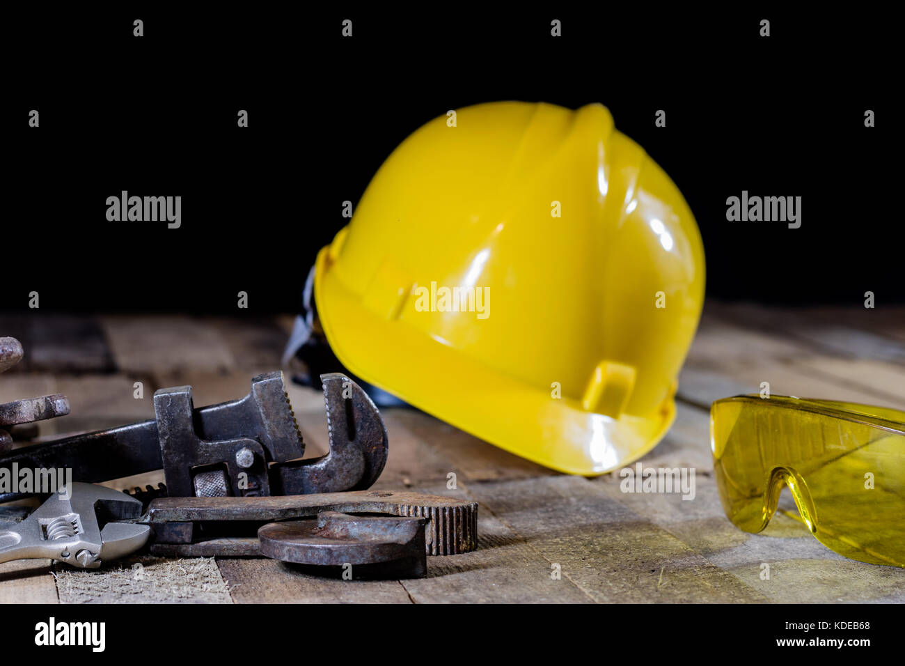 Hydraulics, tools for plumber on wooden table. Workshop, table and ...