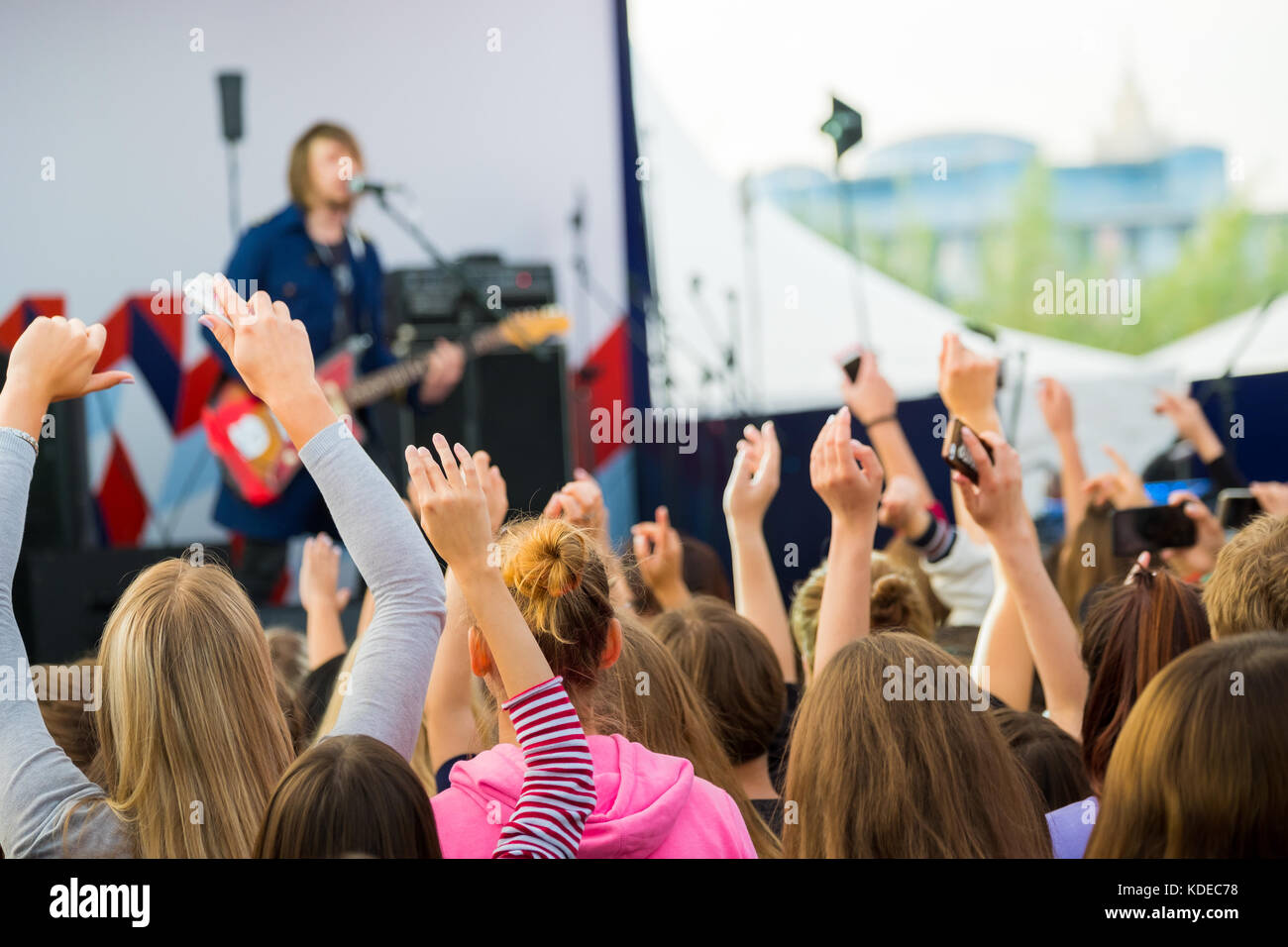 Audience cheering musicians at an open air fest Stock Photo - Alamy