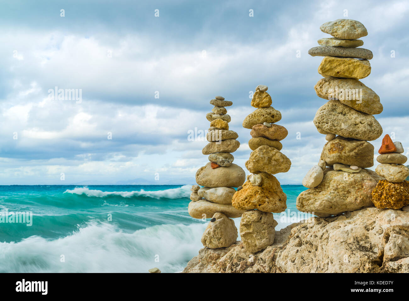 A balanced pile of stones in front of the waves from the ocean Stock ...