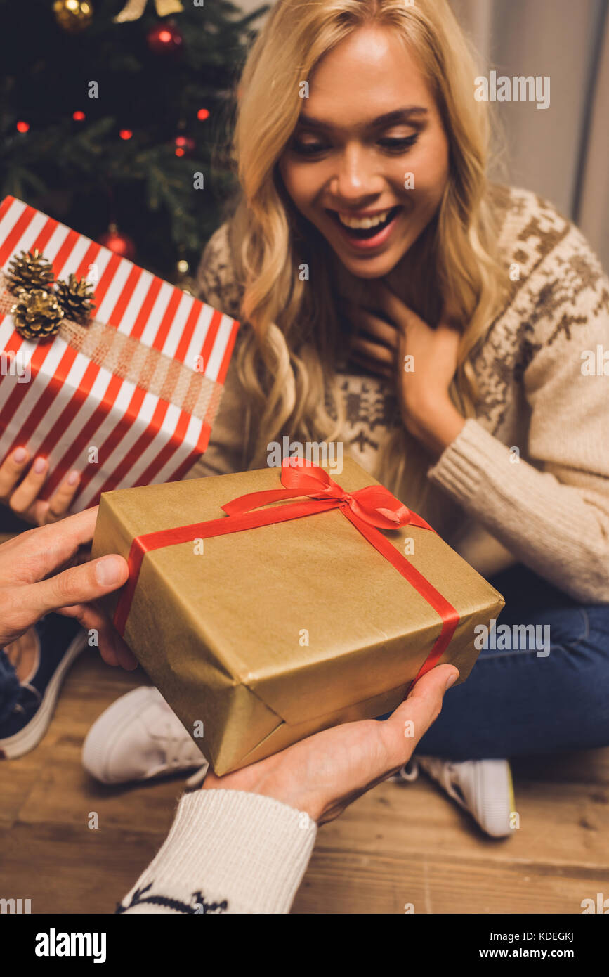 couple exchanging christmas gifts Stock Photo - Alamy