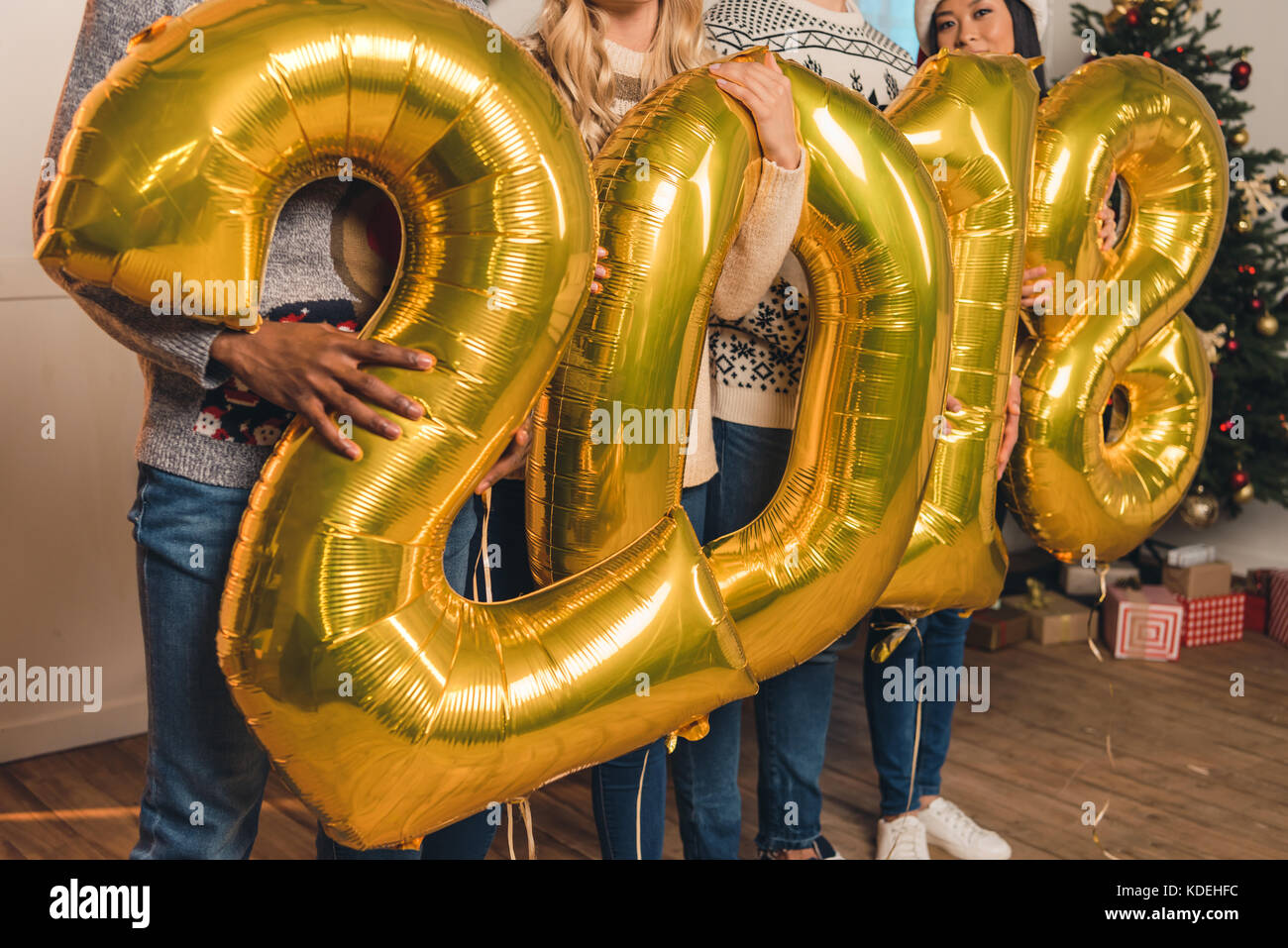 multicultural friends holding 2018 balloons Stock Photo - Alamy
