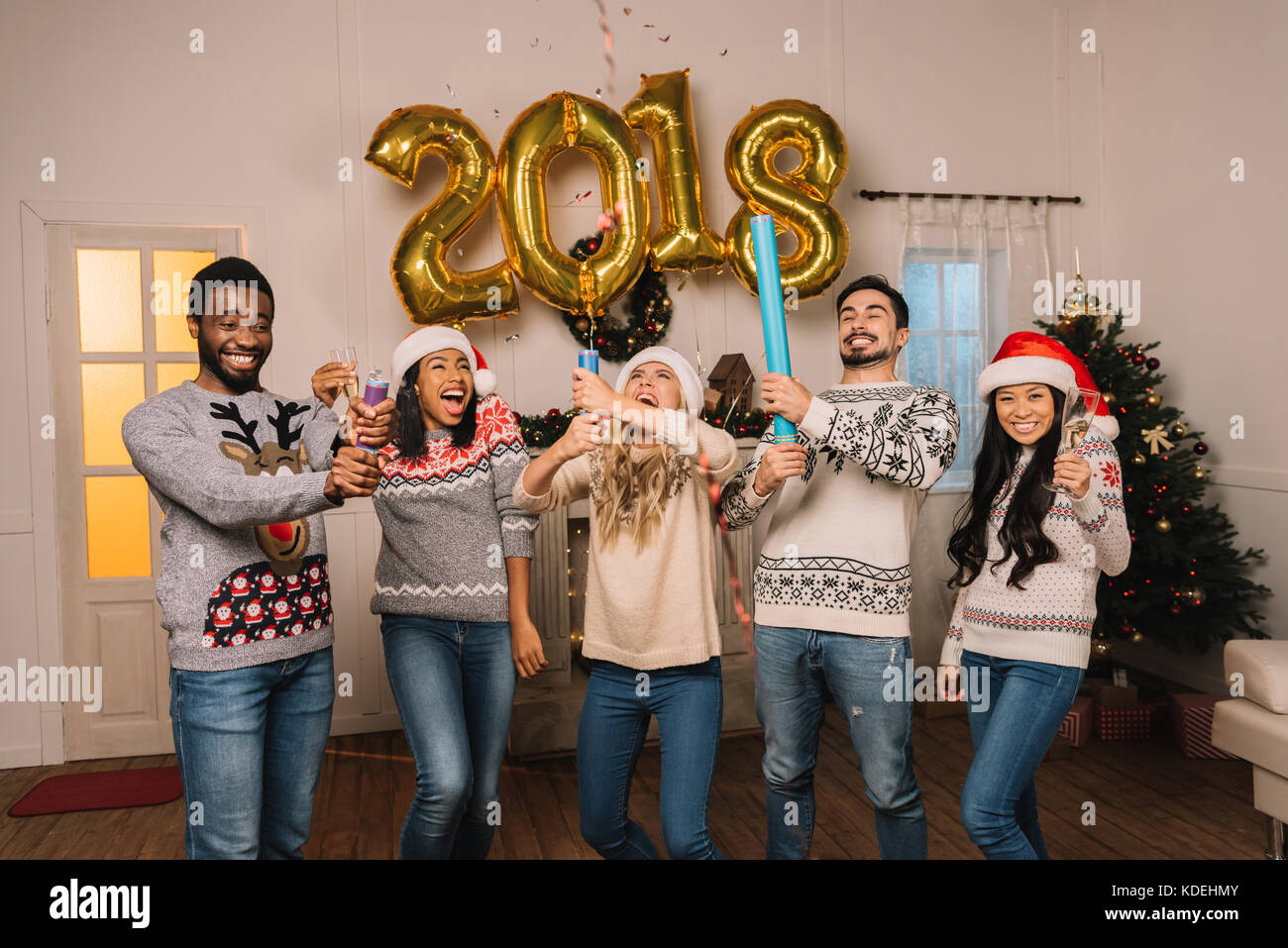 multicultural friends celebrating new year Stock Photo - Alamy