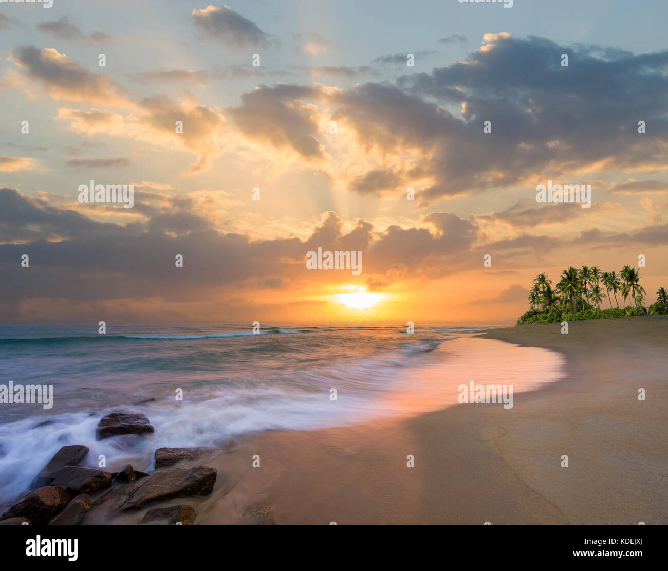 Paradise Tropical beach at sunset Stock Photo - Alamy