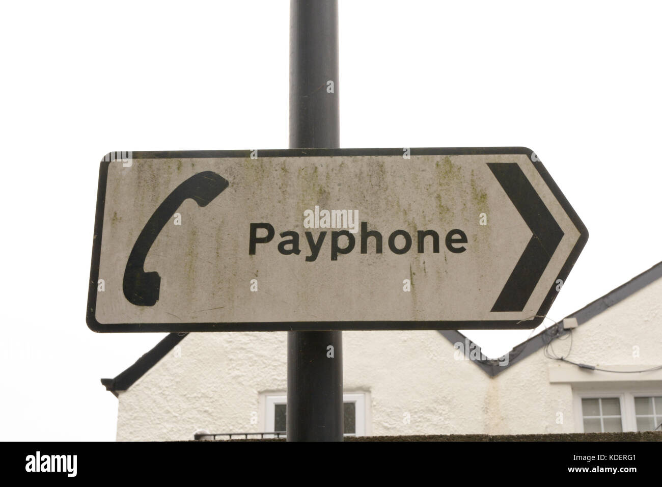 Payphone sign with direction arrow Stock Photo - Alamy
