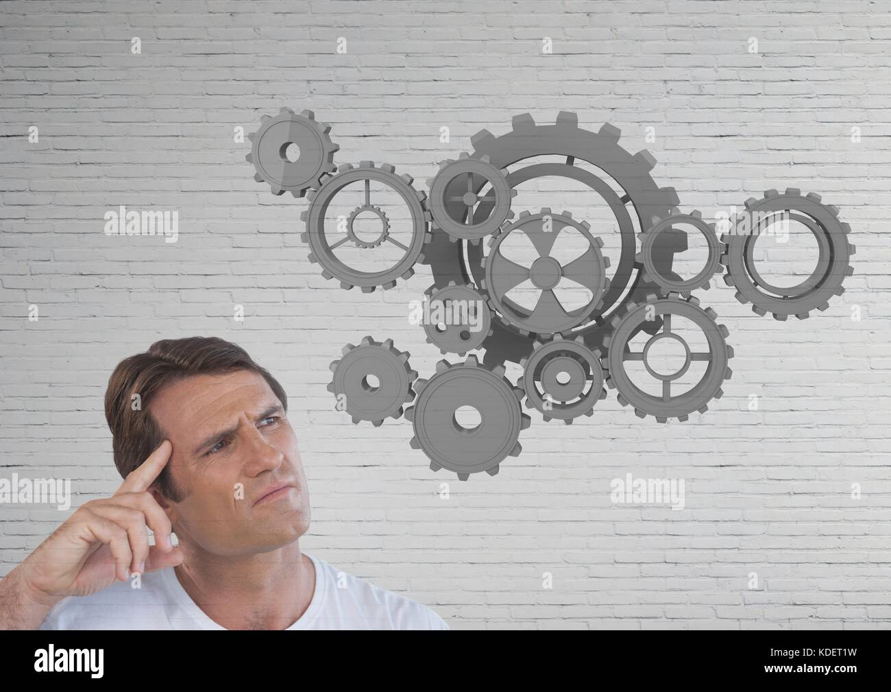 Digital composite of man looking up at question mark Stock Photo - Alamy