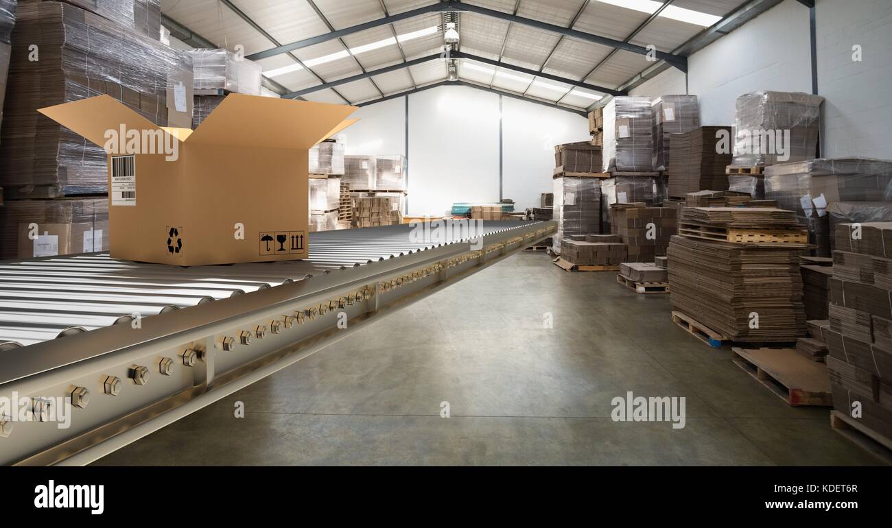 Digital composite of box on conveyor belt in warehouse, transition ...