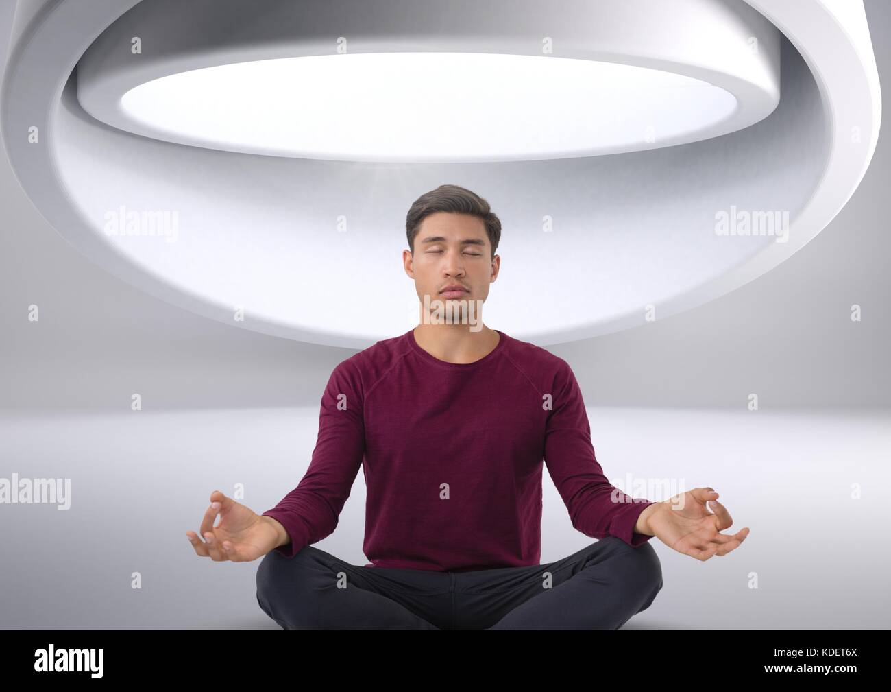 Digital composite of Man meditating in futuristic space Stock Photo - Alamy