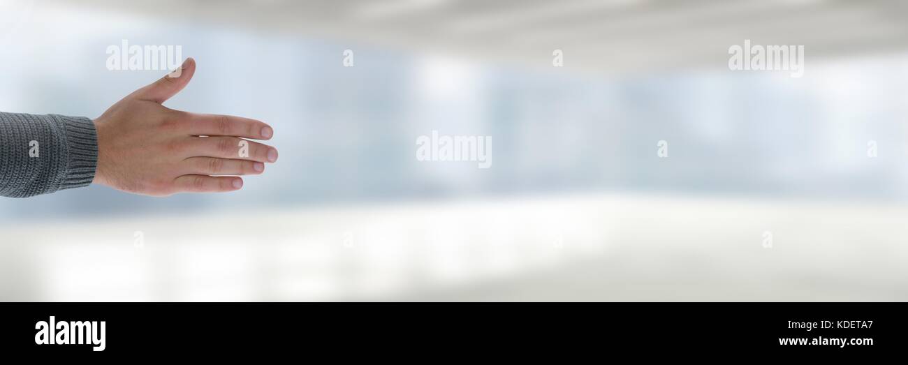 Digital composite of Hand offering handshake with bright background ...