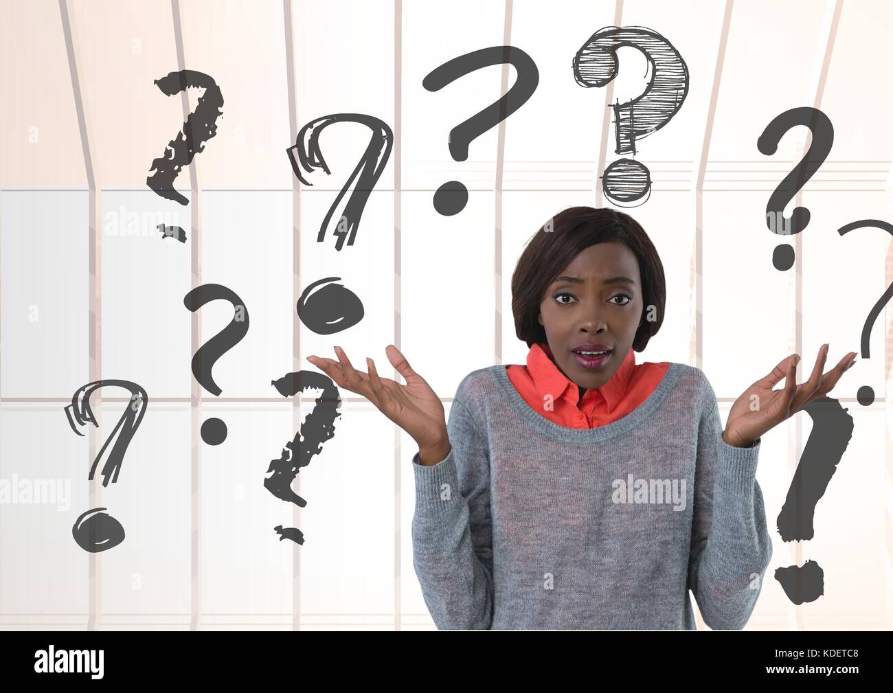 Digital composite of confused woman with question marks Stock Photo - Alamy