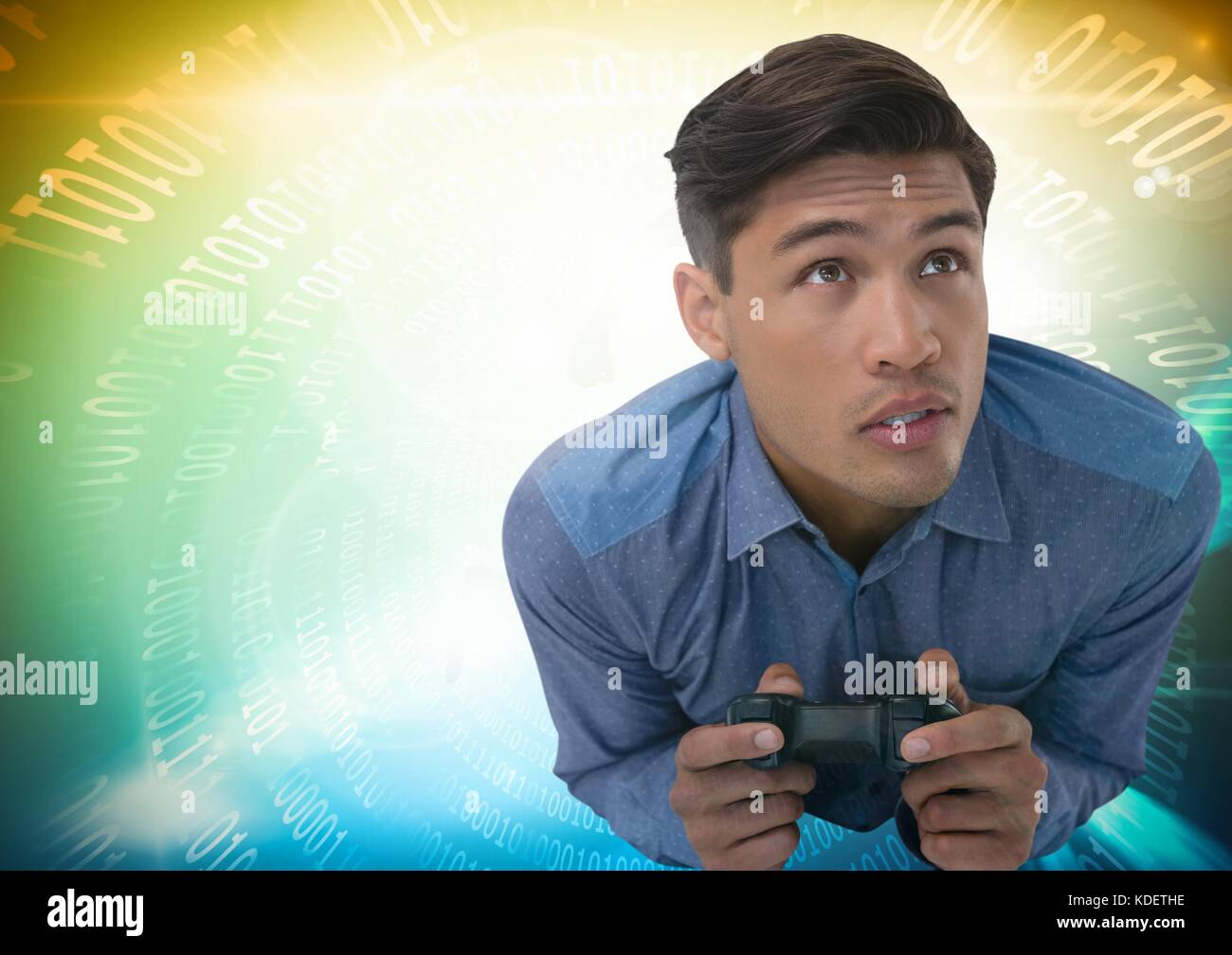 Digital composite of man playing with computer game controller with ...
