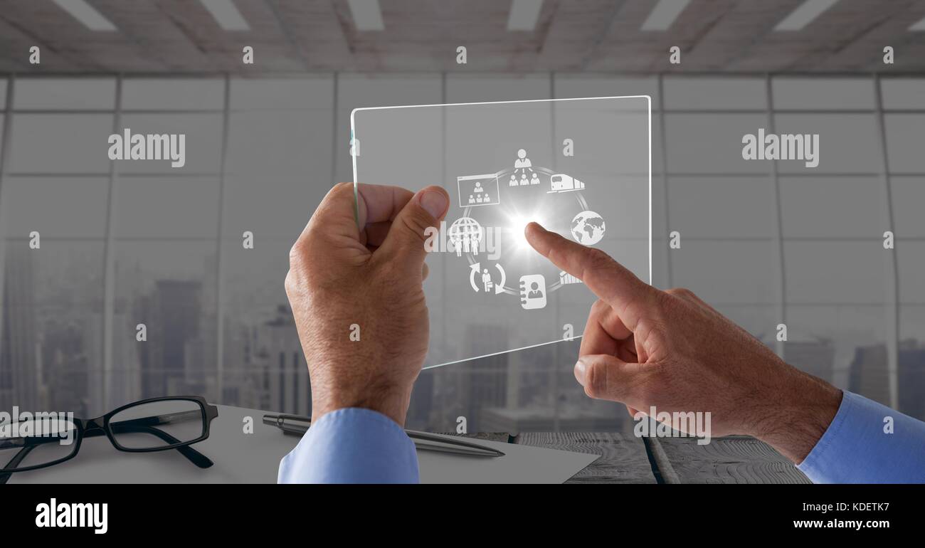 Digital composite of man holding glass interface Stock Photo - Alamy