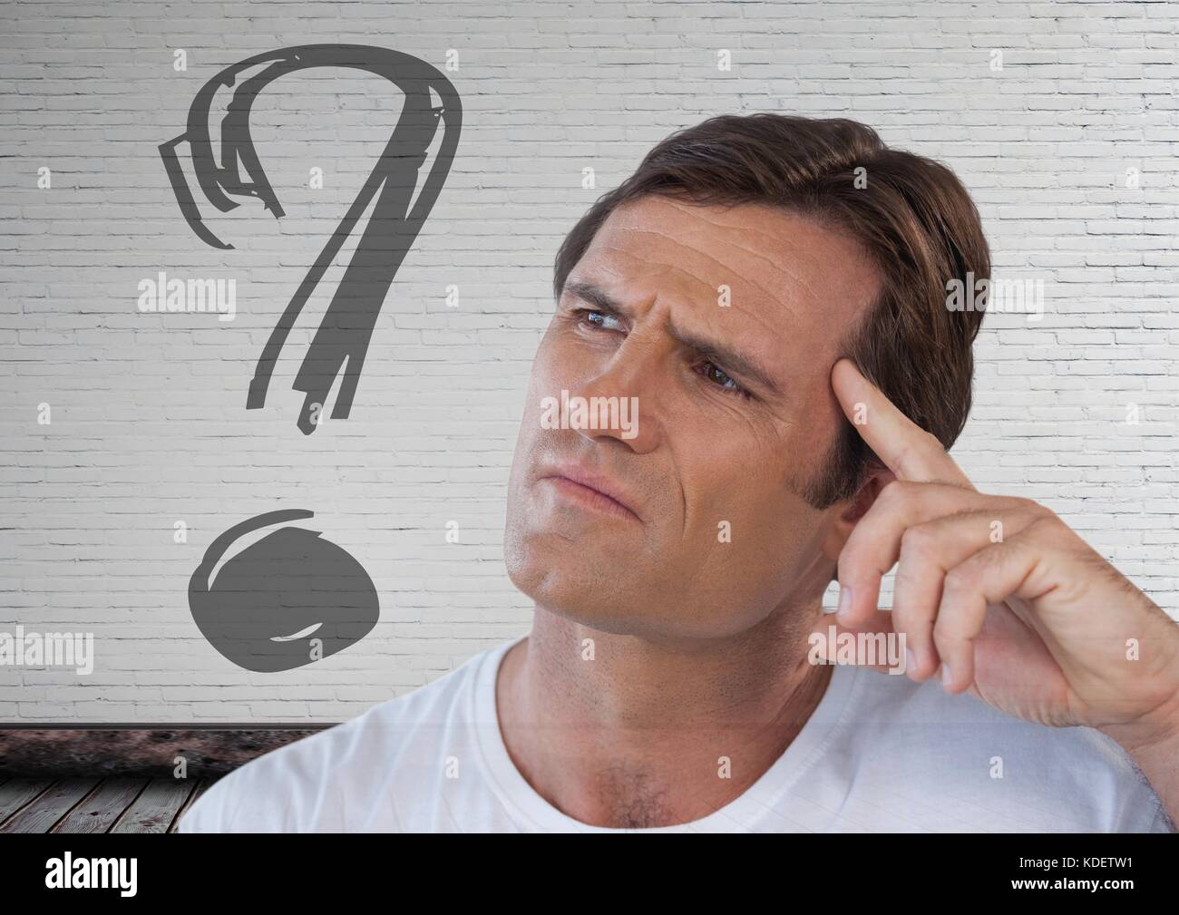 Digital composite of man looking up at question mark Stock Photo - Alamy