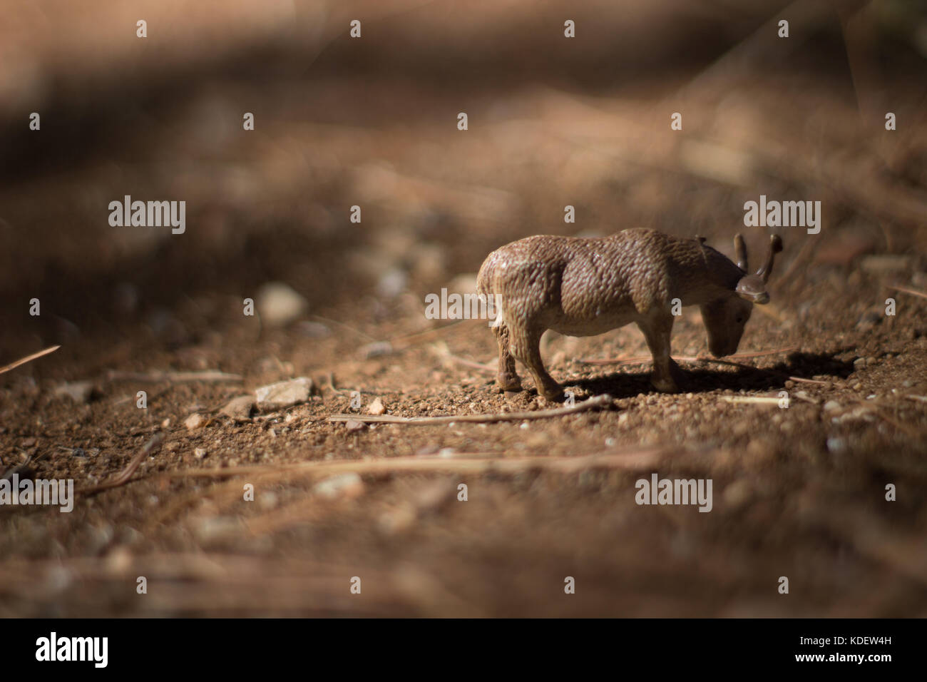 plastic goat toy eating grass on the nature close up Stock Photo - Alamy