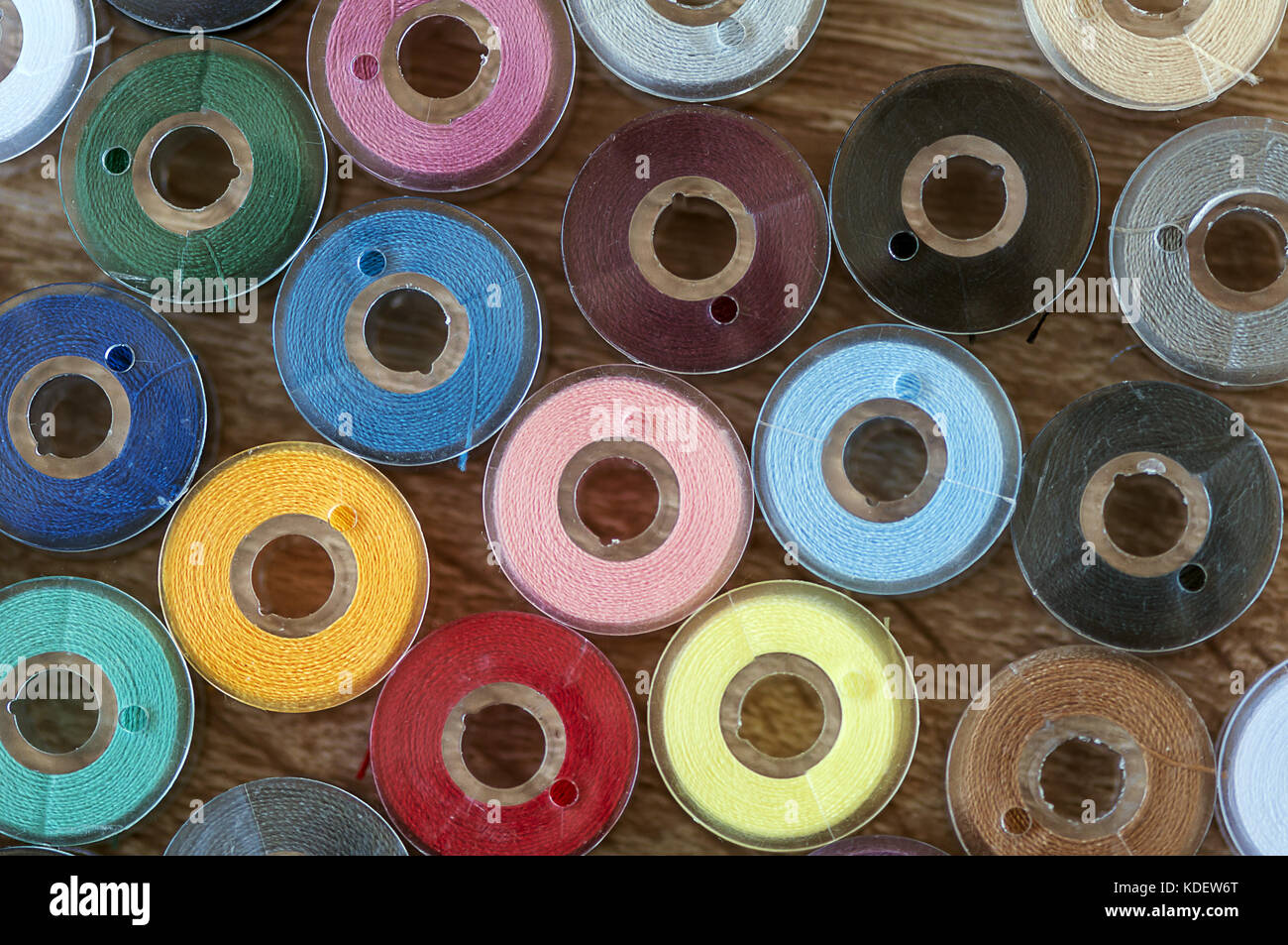 Close-up on colored sewing threads on spools. Top view Stock Photo - Alamy