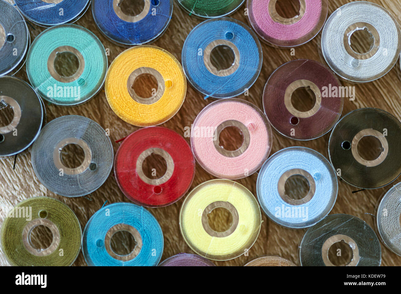 Close-up on colored sewing threads on spools. Top view Stock Photo - Alamy