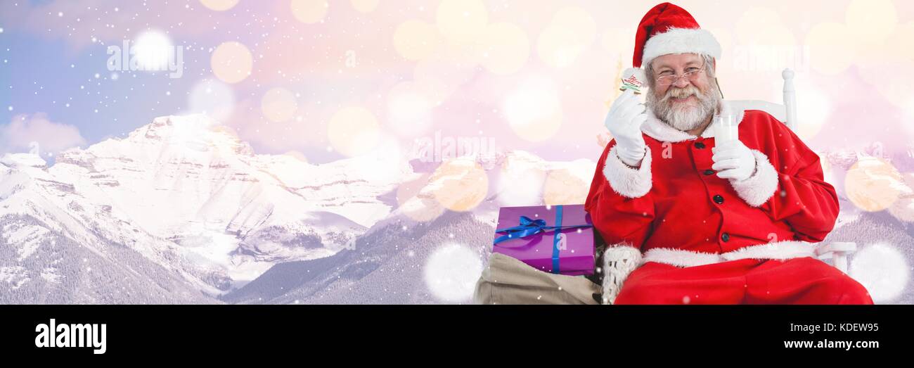 Digital composite of Santa with Winter landscape with gifts Stock Photo ...