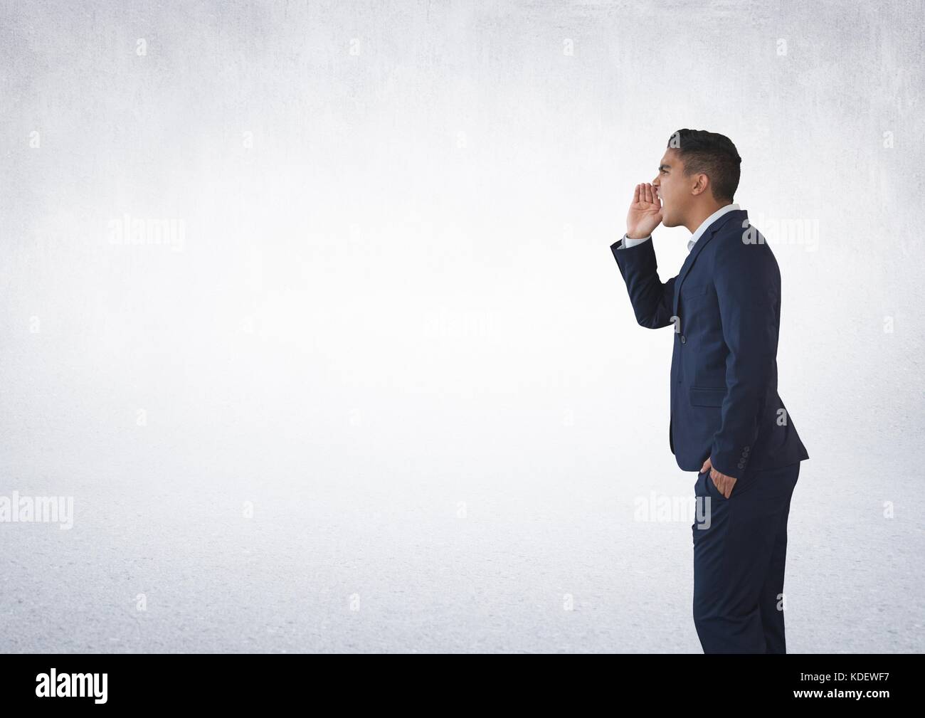 Digital composite of Businessman shouting in room Stock Photo - Alamy