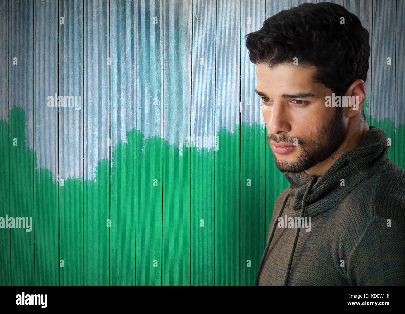 Digital composite of Man against wood with dramatic contemplative ...