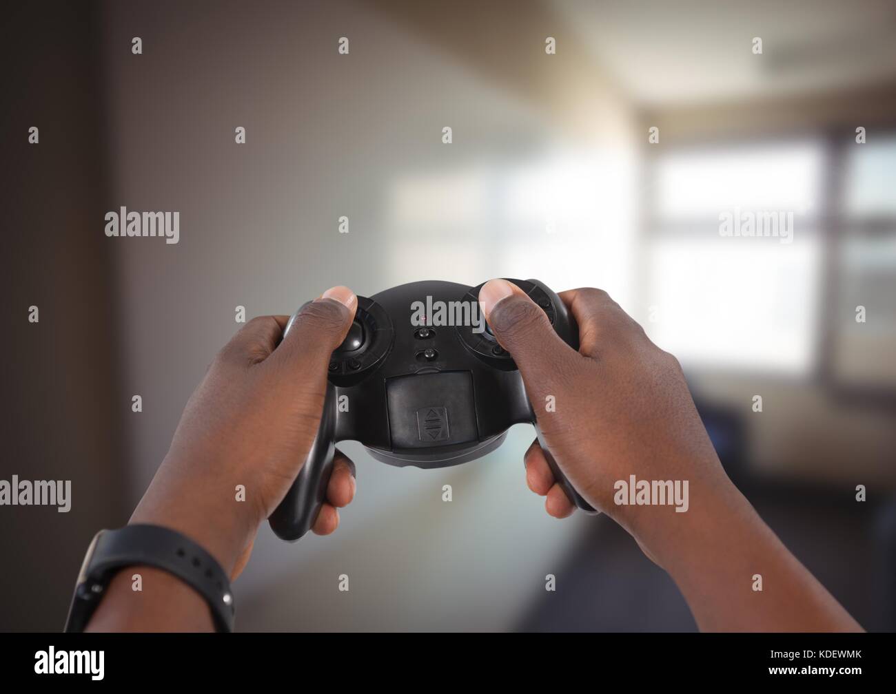 Digital composite of Hands playing with computer game controller with ...