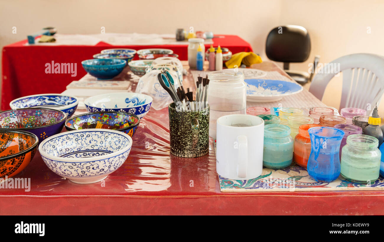 Artist's table in the ceramic workshop Stock Photo - Alamy