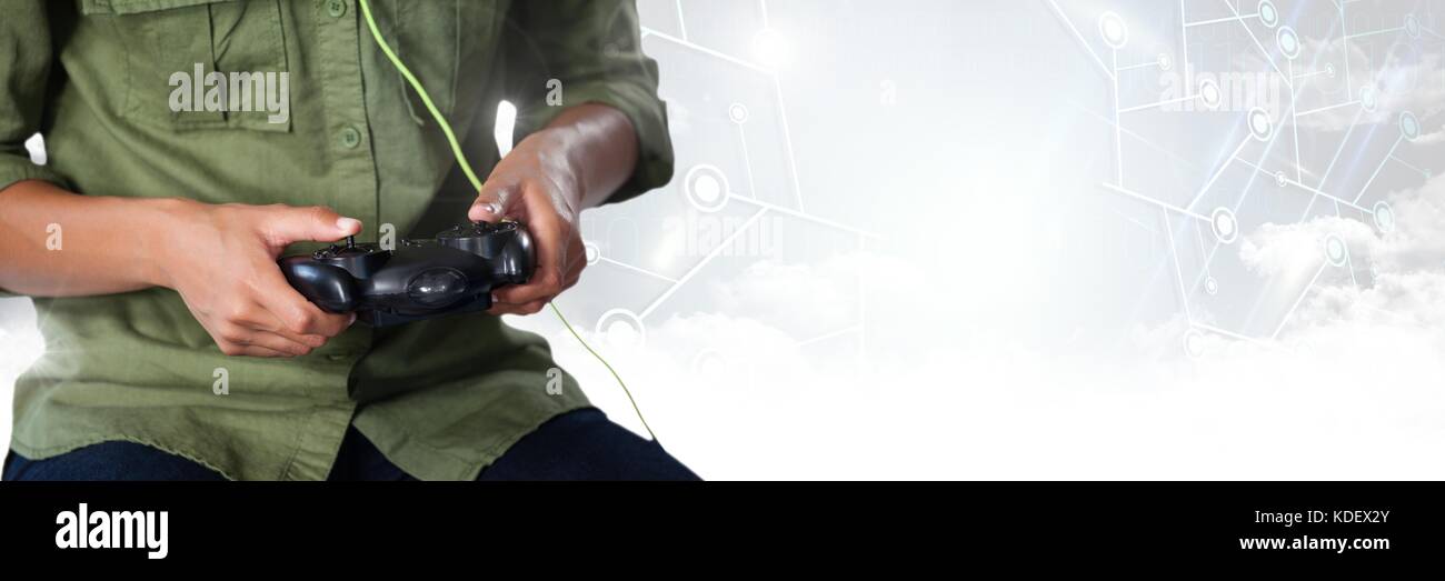 Digital composite of man playing with computer game controller with ...